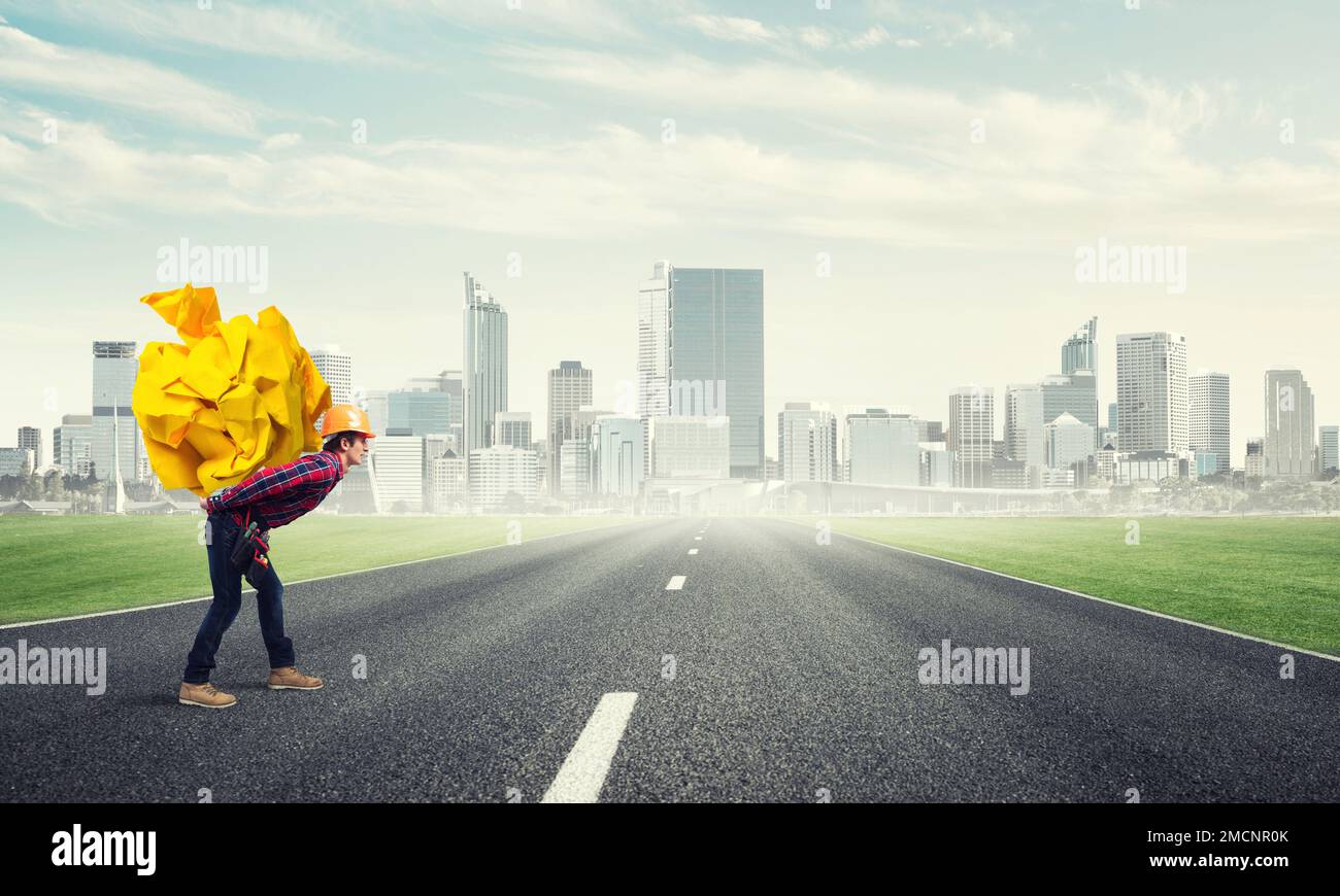 Engineer man carry load Stock Photo - Alamy