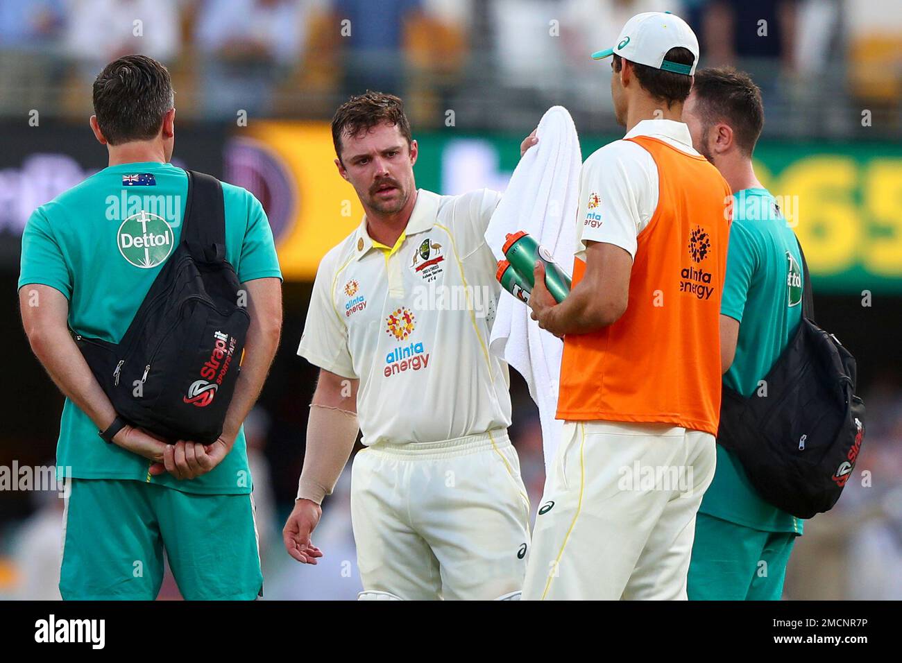 Australia's Travis Head, centre, is checked by teammates after he was ...