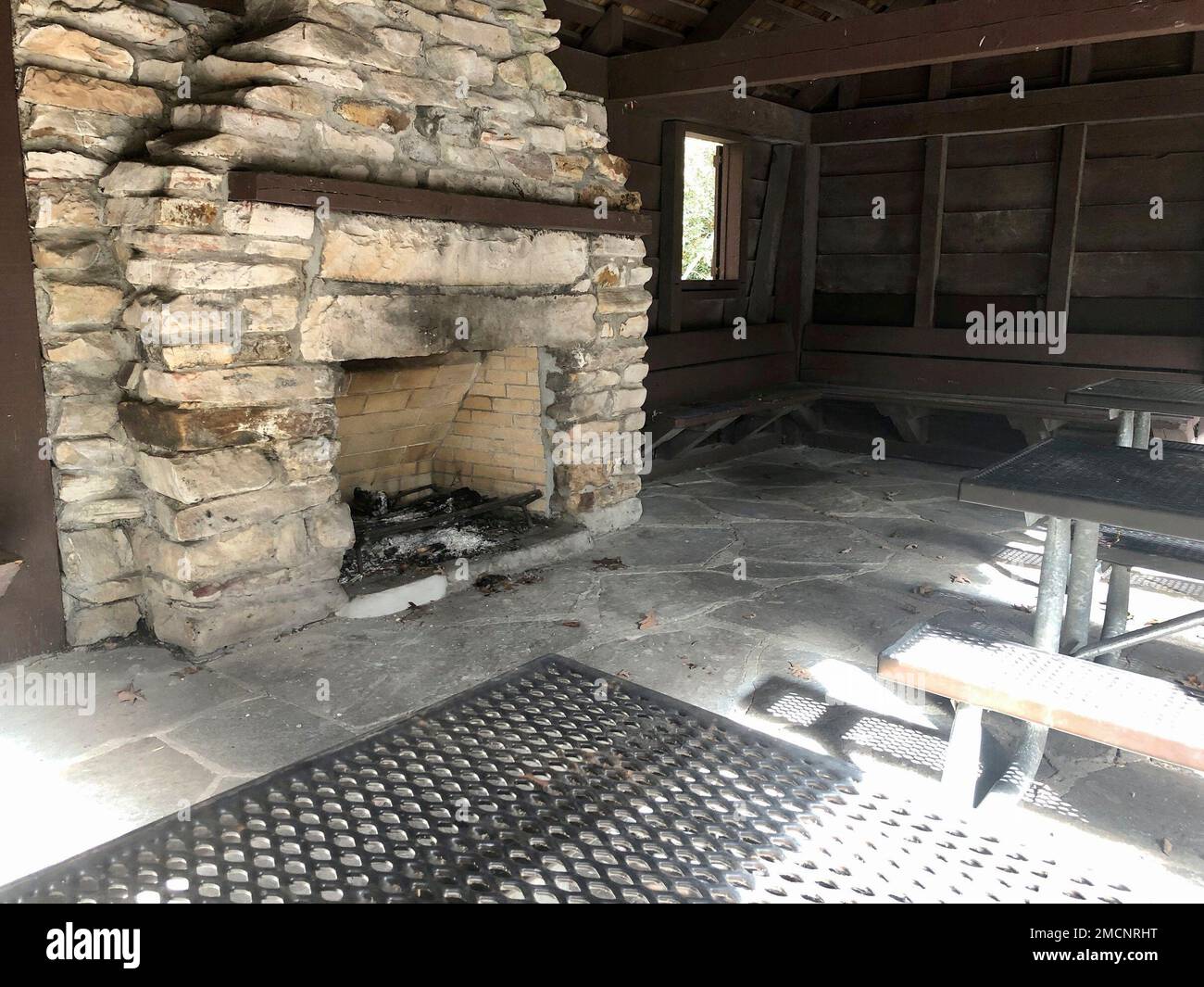 A repaired fireplace in a picnic shelter originally built by the ...