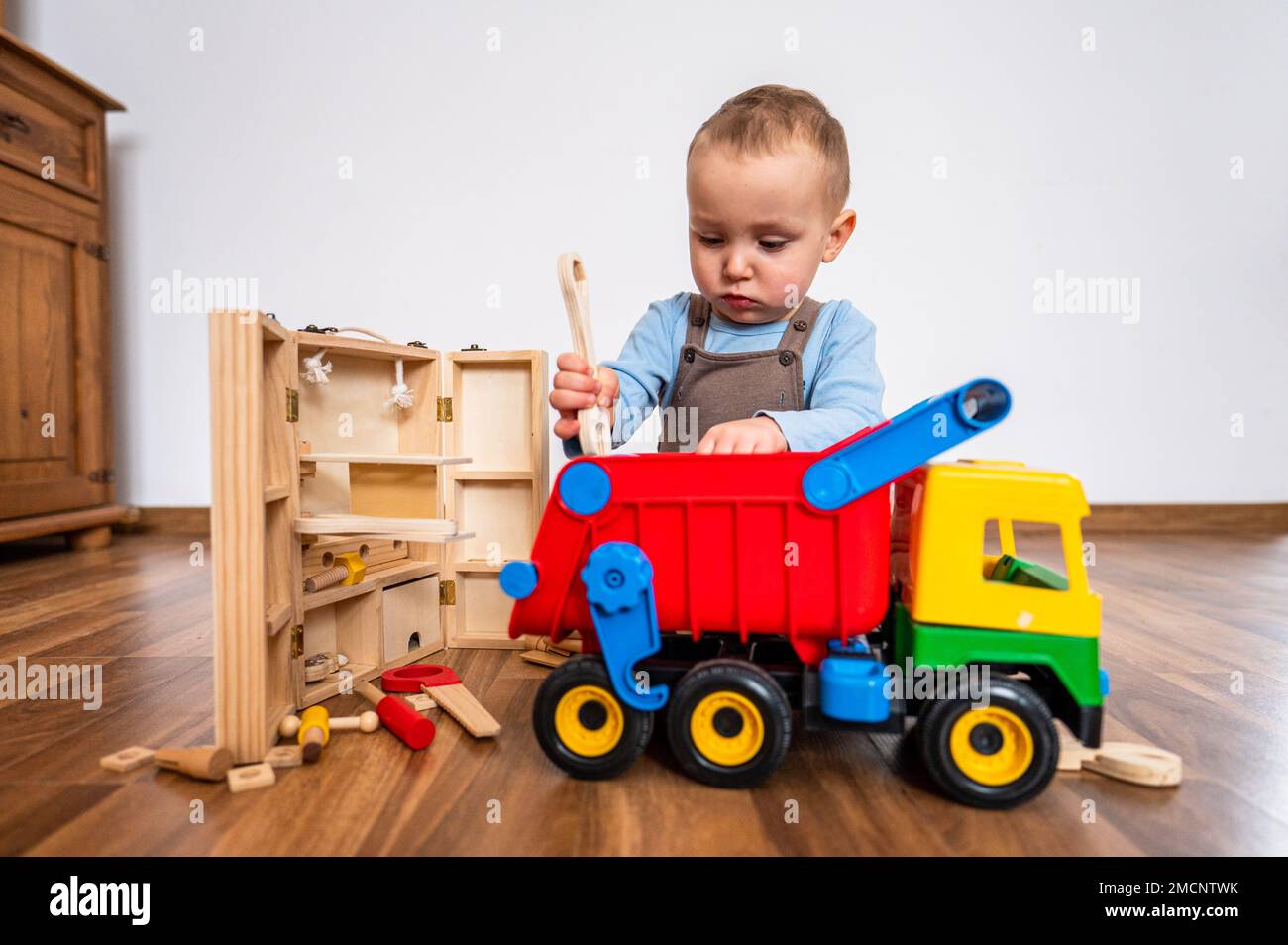A two-year-old boy is playing car mechanic at home Stock Photo - Alamy