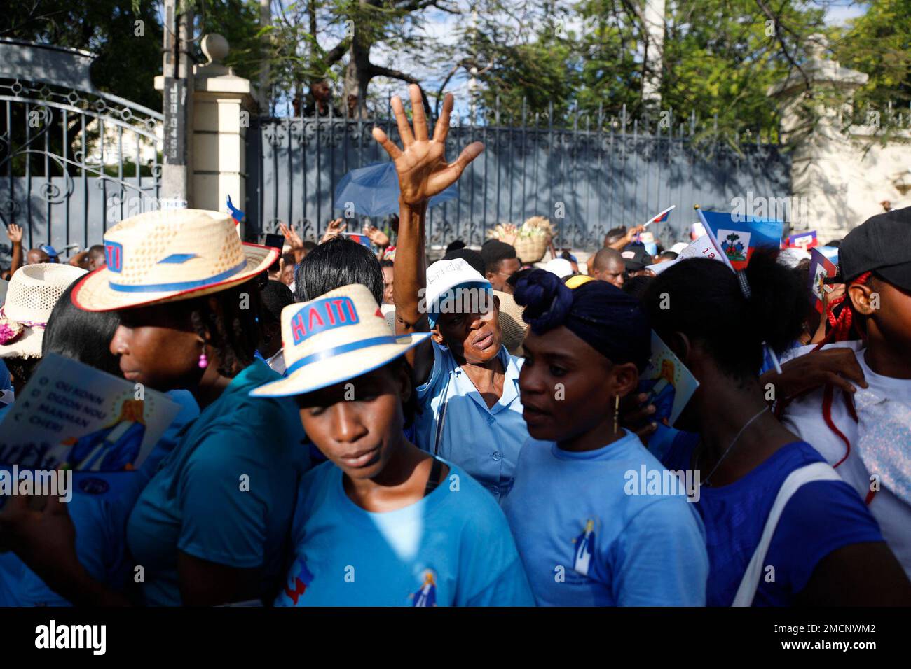 Catholic faithful participate in a procession in observance of the ...