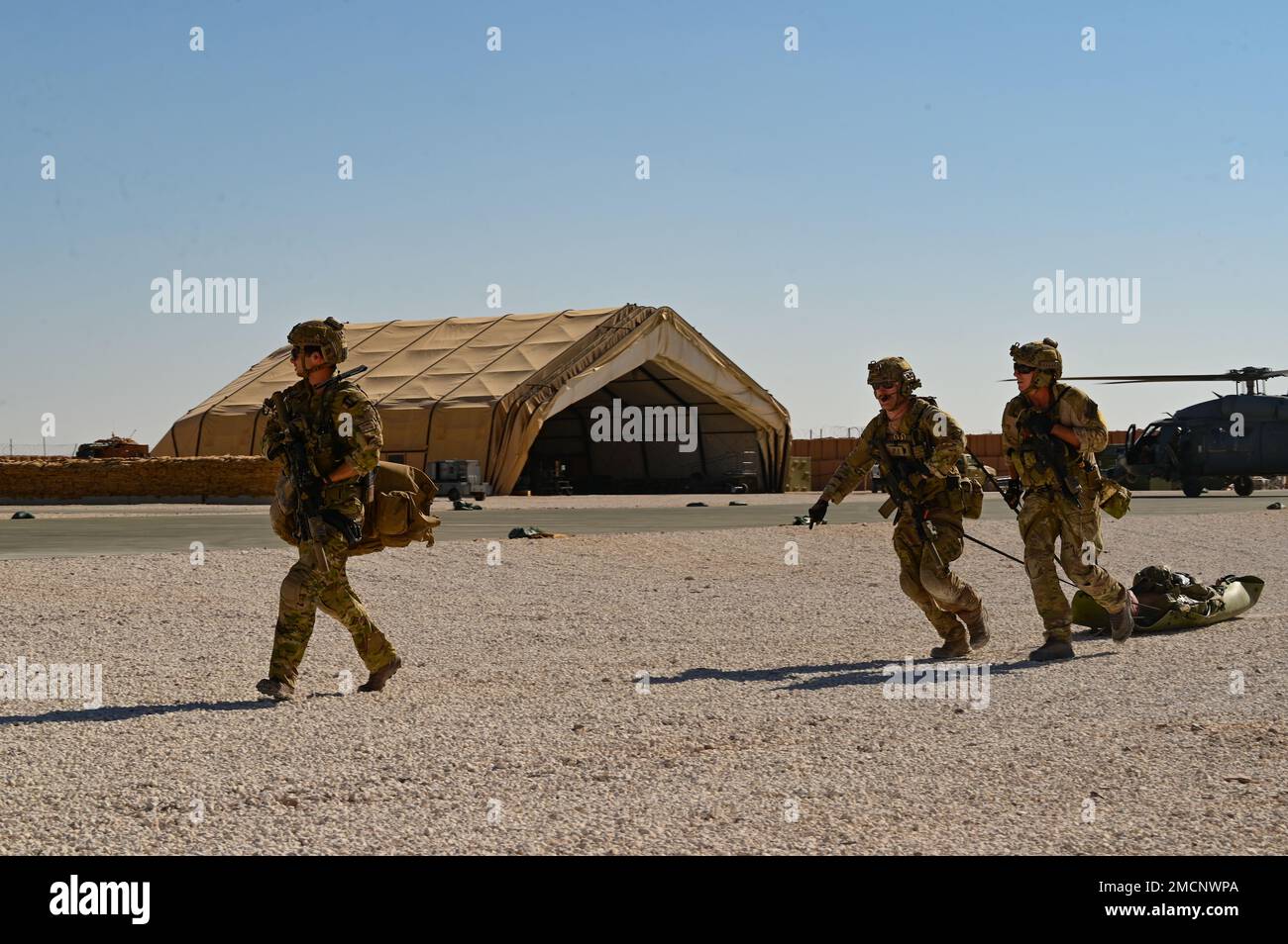 U.S. Air Force pararescuemen, assigned to the 52nd Expeditionary Rescue ...