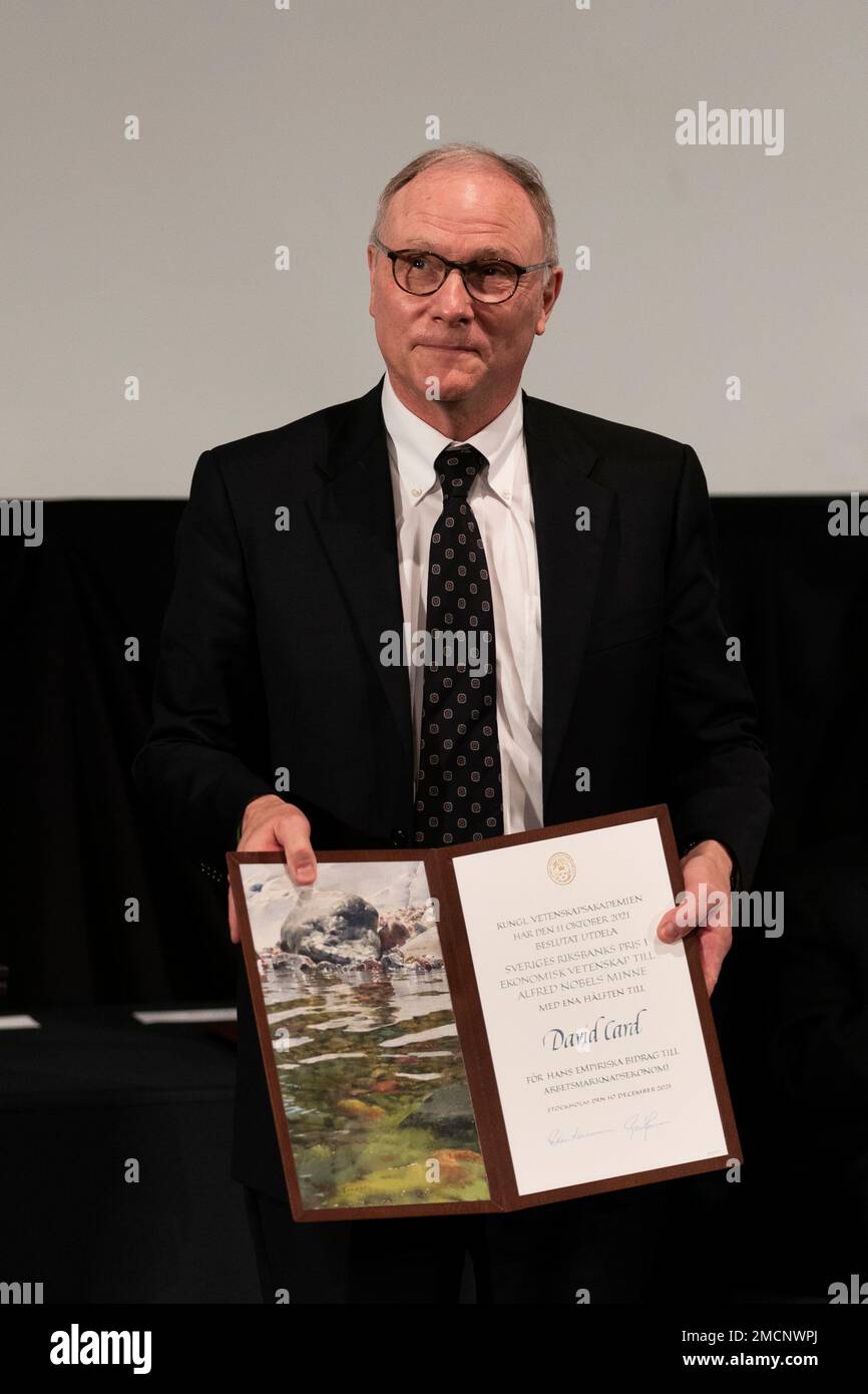David Card, a Nobel Prize recipient in Economic Sciences, holds his ...