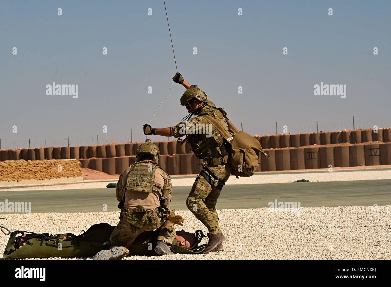 U.S. Air Force pararescuemen, assigned to the 52nd Expeditionary Rescue ...