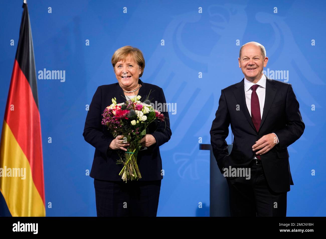 New elected German Chancellor Olaf Scholz, right, and former Chancellor ...