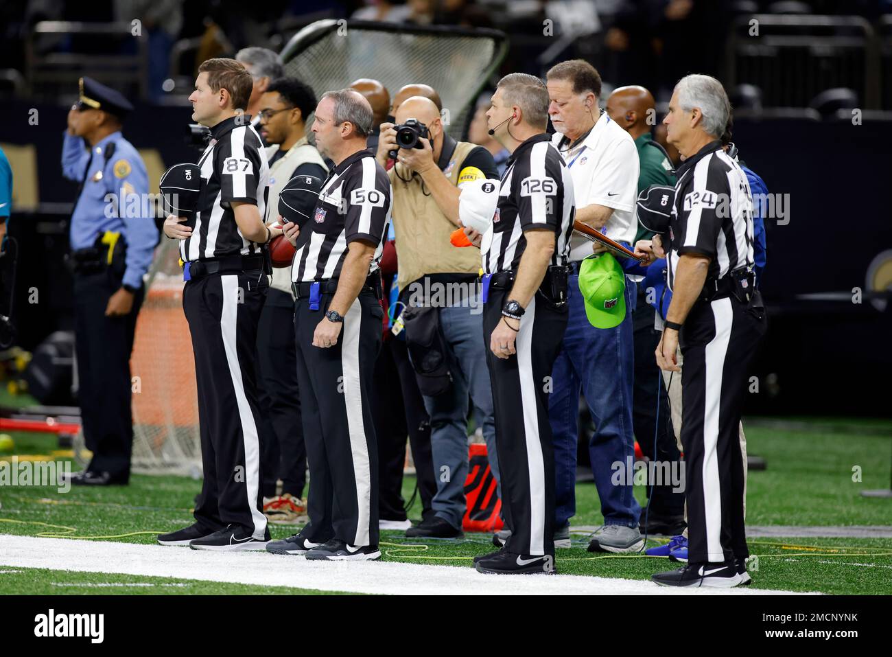 NFL line judge Tom Eaton (87), field judge Aaron Santi (50), referee ...