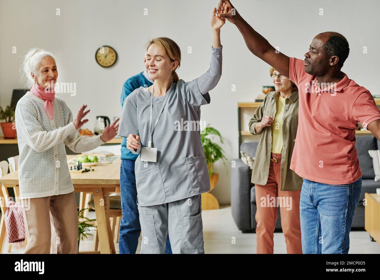 Senior people having dance lesson in nursing home, they dancing with ...