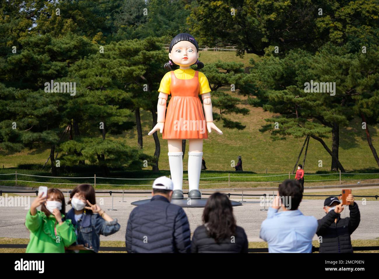 Visitors take photos a model of the doll named 'Younghee' that is ...