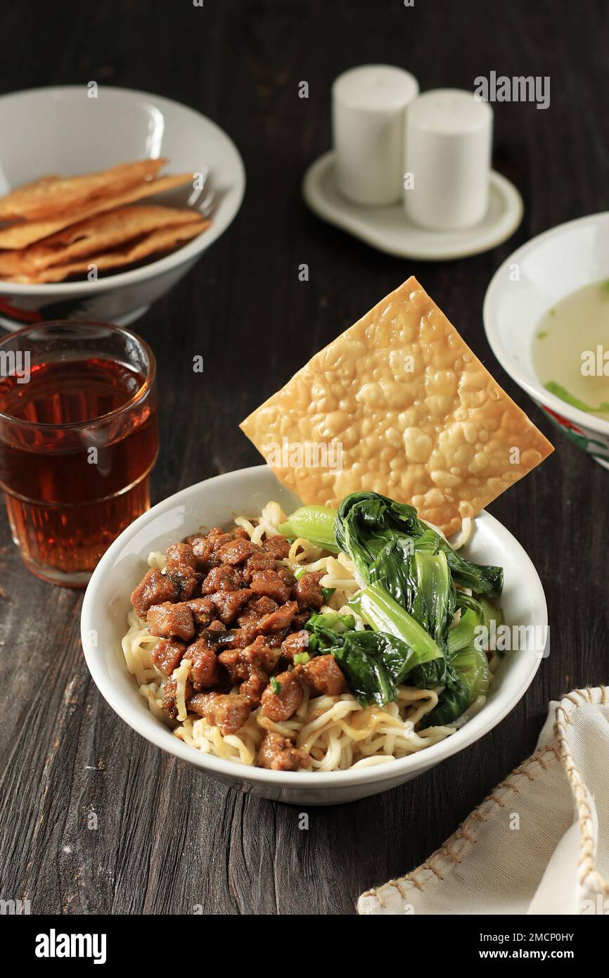 Mie Ayam, Chicken Noodle with Crispy Dumpling Cracker and Clear Broth ...