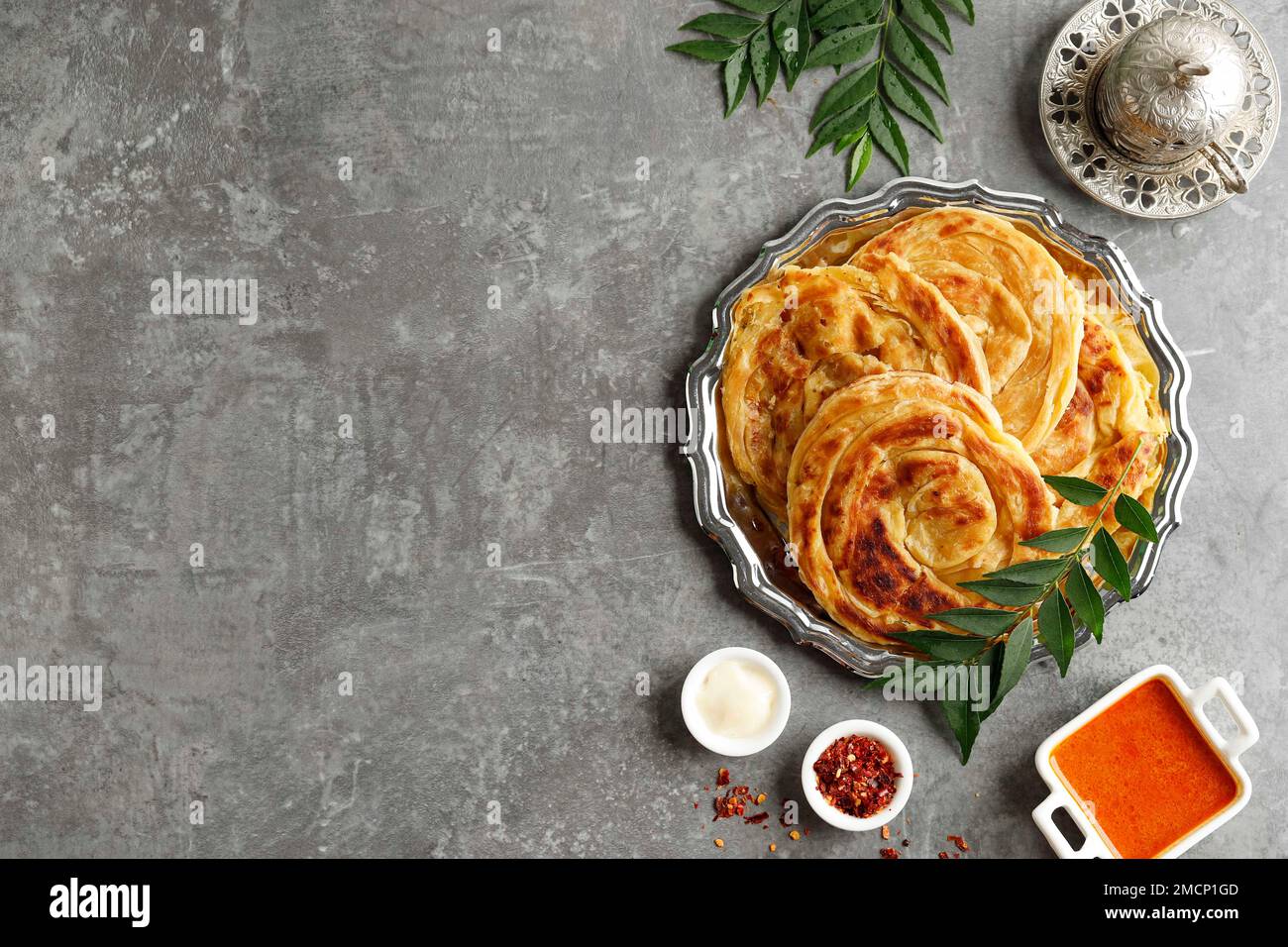 Roti Parata or Roti Canai with Lamb Curry Sauce and Yoghurt. Top View ...