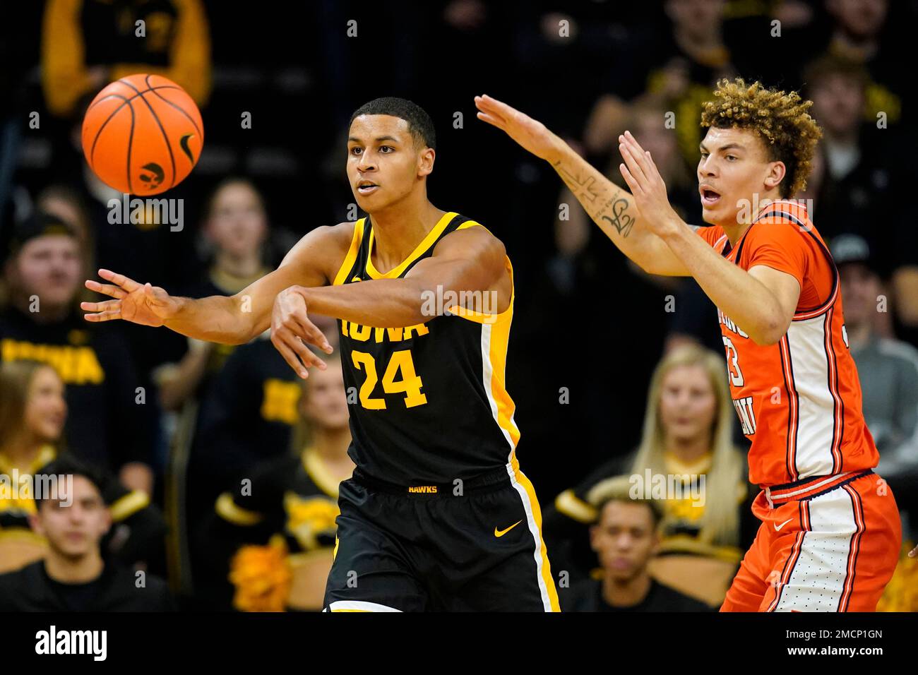 Iowa forward Kris Murray (24) passes ahead of Illinois forward Coleman ...