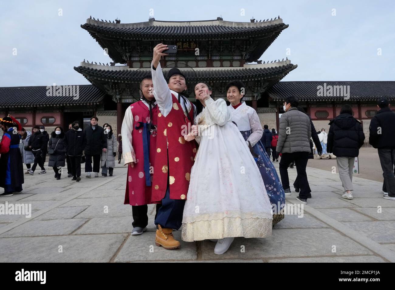 People wearing South Korean traditional "Hanbok" costume take selfie as ...