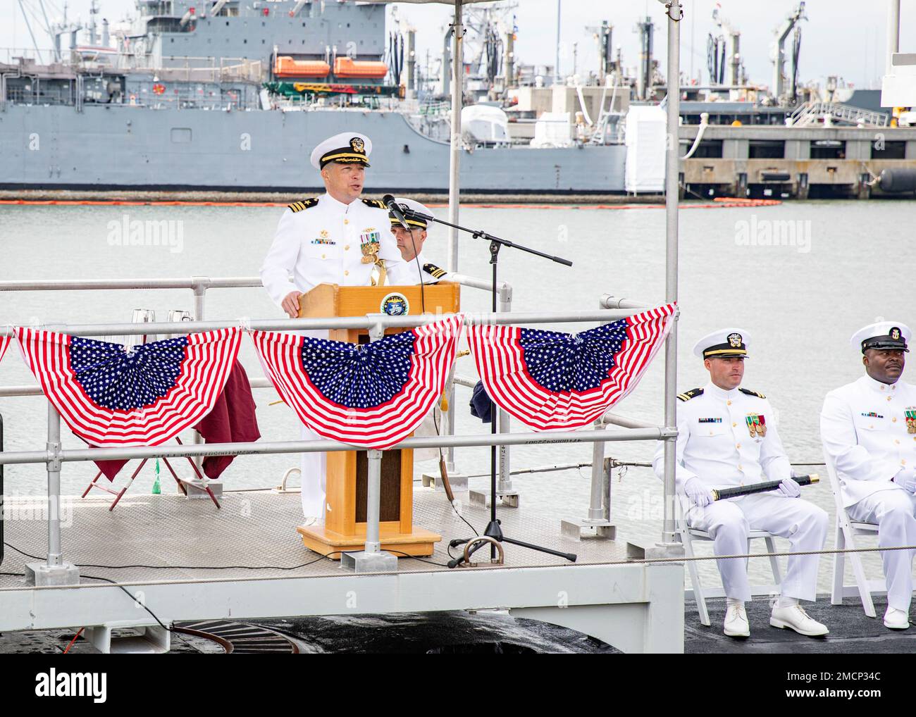 Cmdr. Eric Astle delivers a speech during a change of command ceremony ...