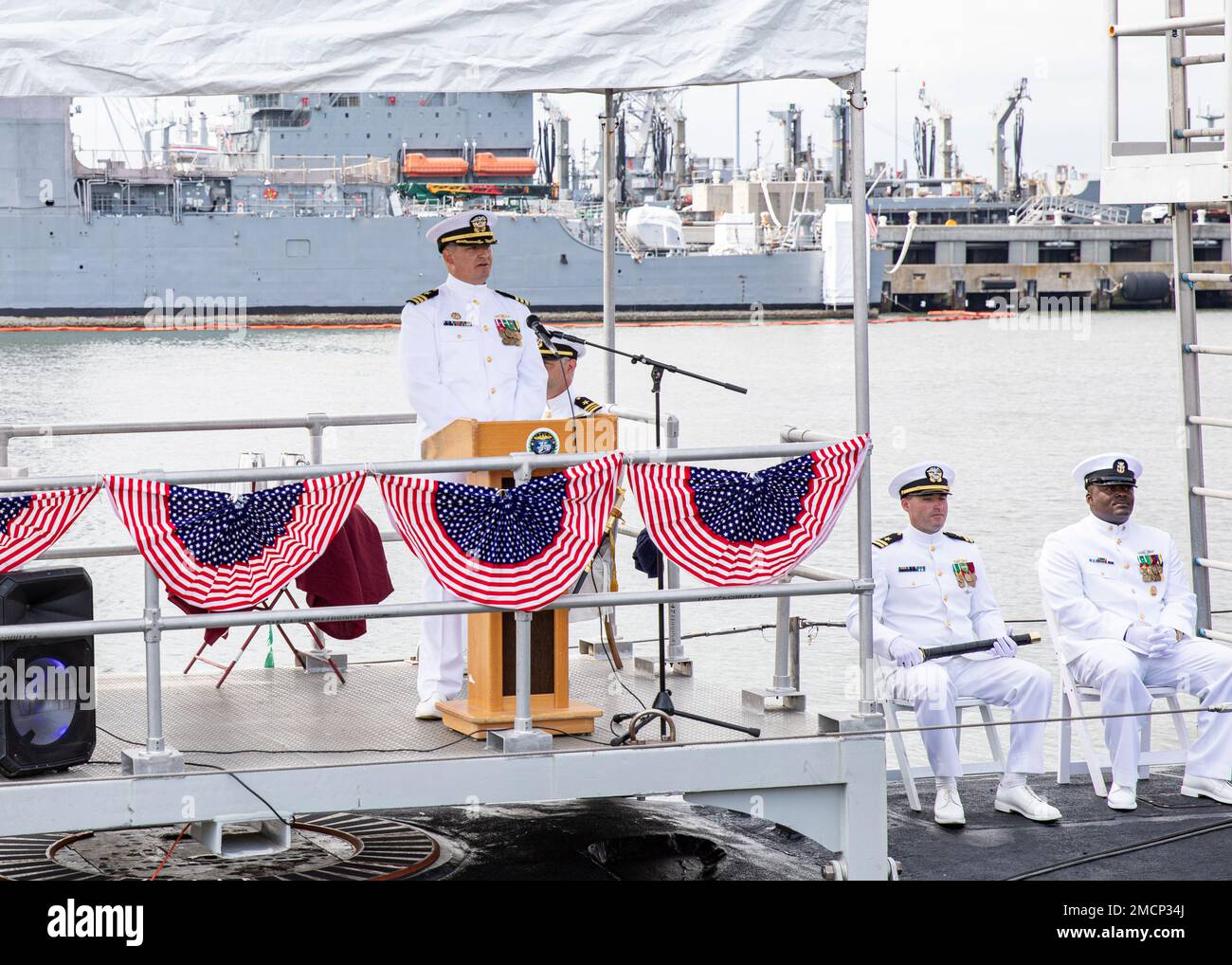 Cmdr. Clint Christofk delivers a speech during a change of command ...