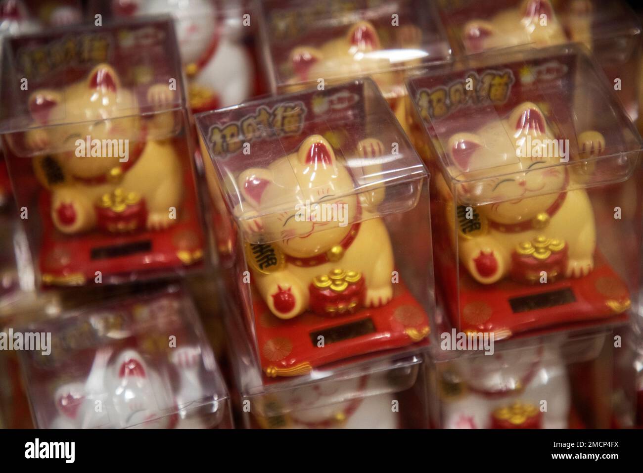 Good luck cats Maneki Neko on the counter in a Chinese souvenir shop ...