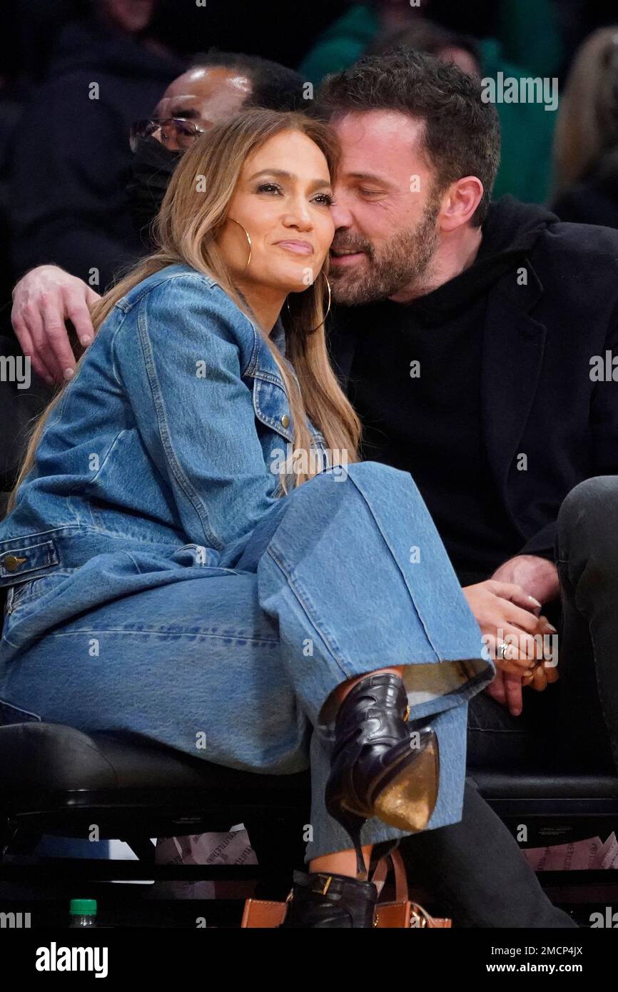 Jennifer Lopez, left, and Ben Affleck attend an NBA basketball game ...
