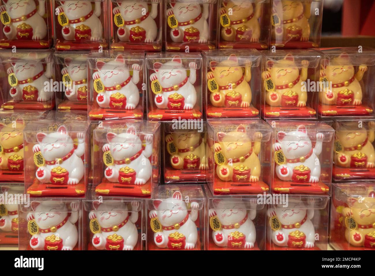 Good luck cats Maneki Neko on the counter in a Chinese souvenir shop ...