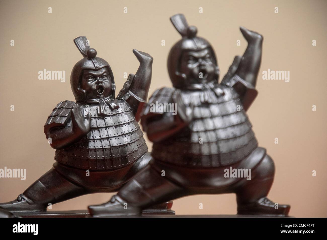 A figurine of a Chinese ancient warrior on the counter in a Chinese ...