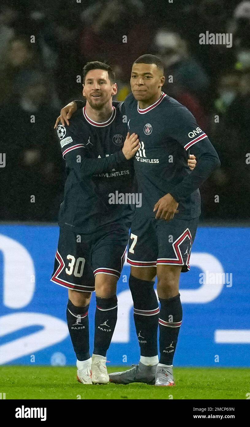 PSG's Kylian Mbappe, right, and PSG's Lionel Messi celebrate after ...