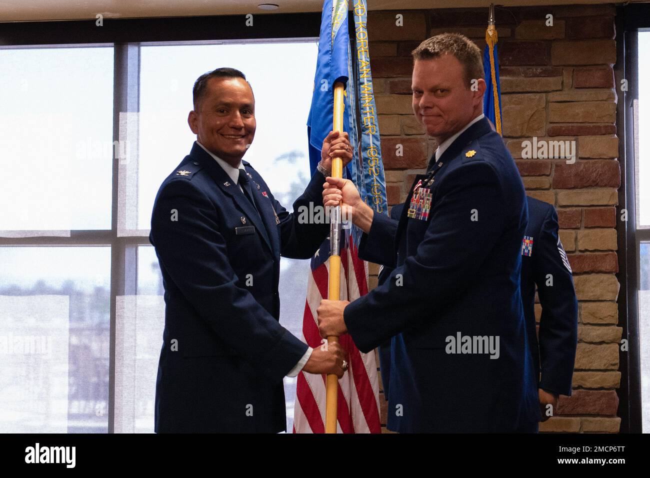 Maj. Jeremy E. Miller, 49th Force Support Squadron commander, passes ...