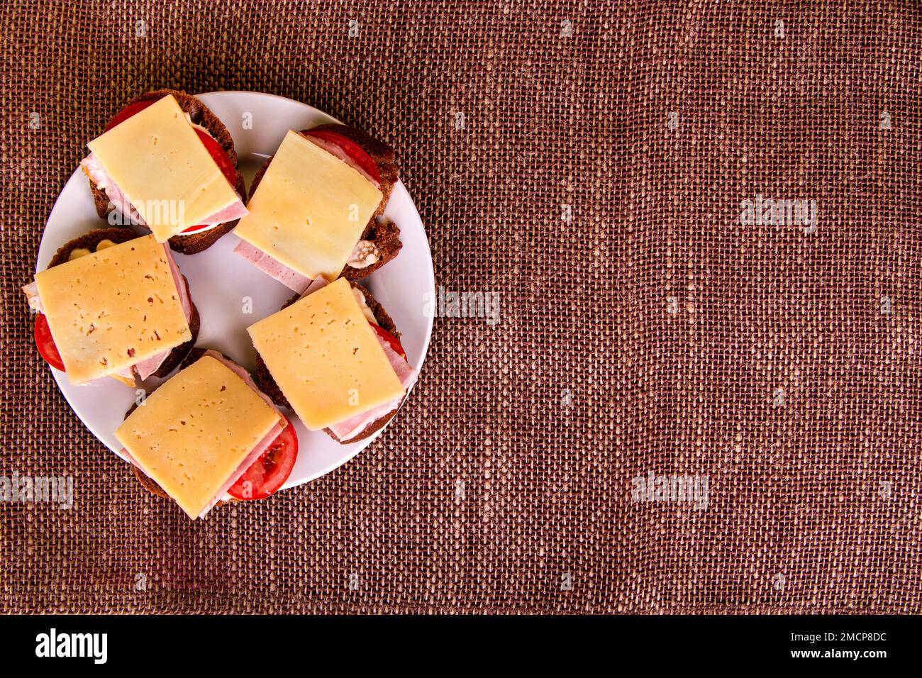 Open sandwiches with ham and cheese. Self-made food. Top view. Place ...