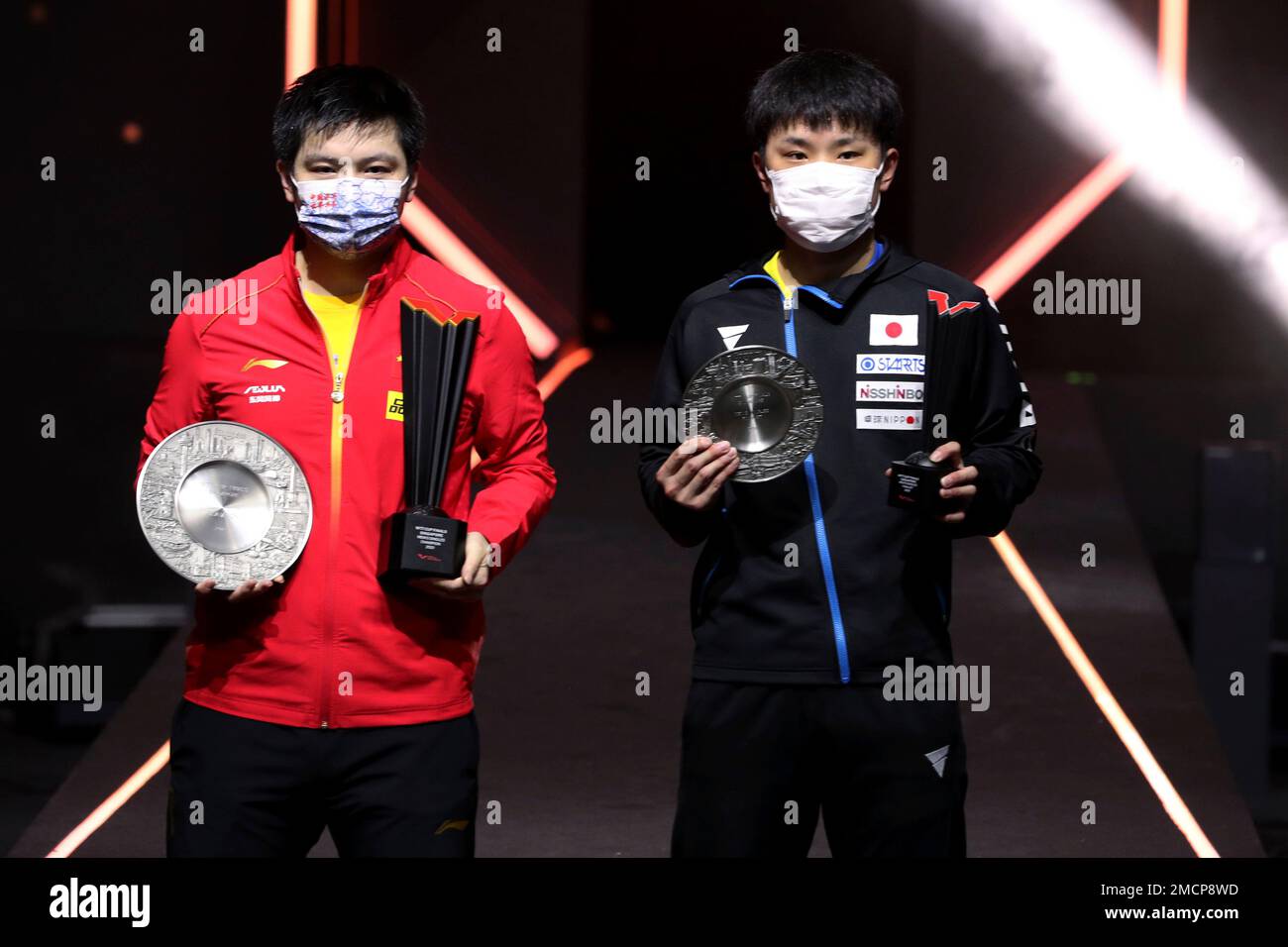 Men's singles champion, China's Fan Zhendong, left, and runner up ...
