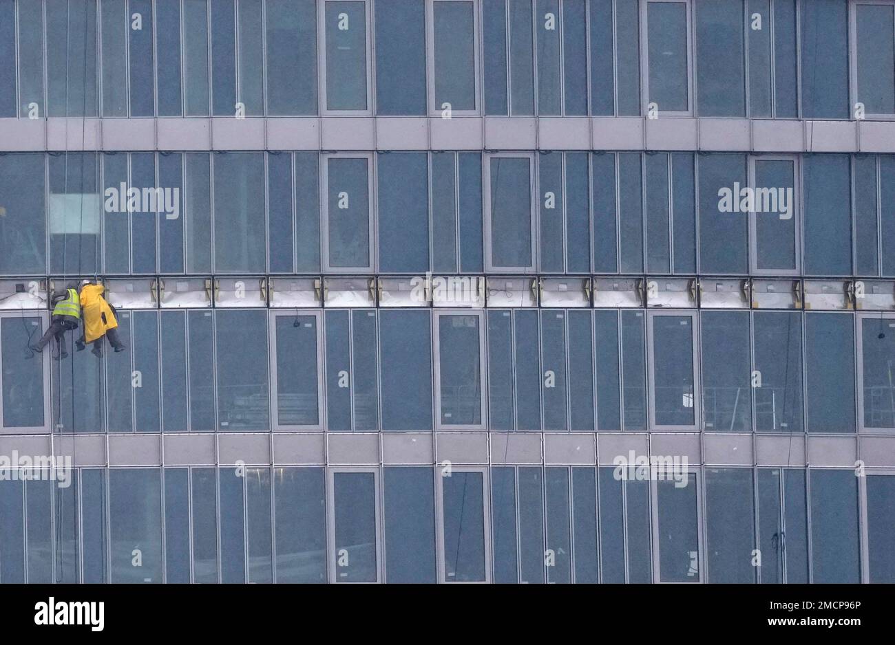 Workers are seen on a landmark 200-meter high tower, part of Belgrade ...