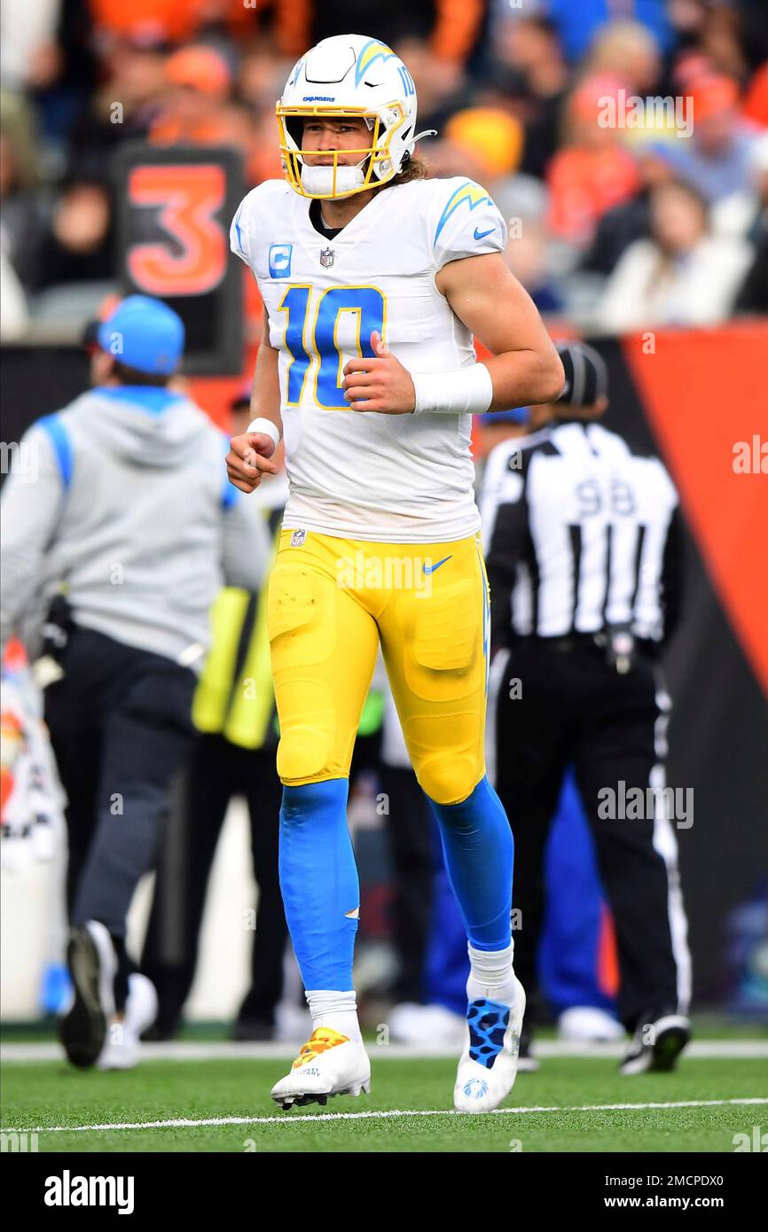 Los Angeles Chargers quarterback Justin Herbert (10) runs onto the ...