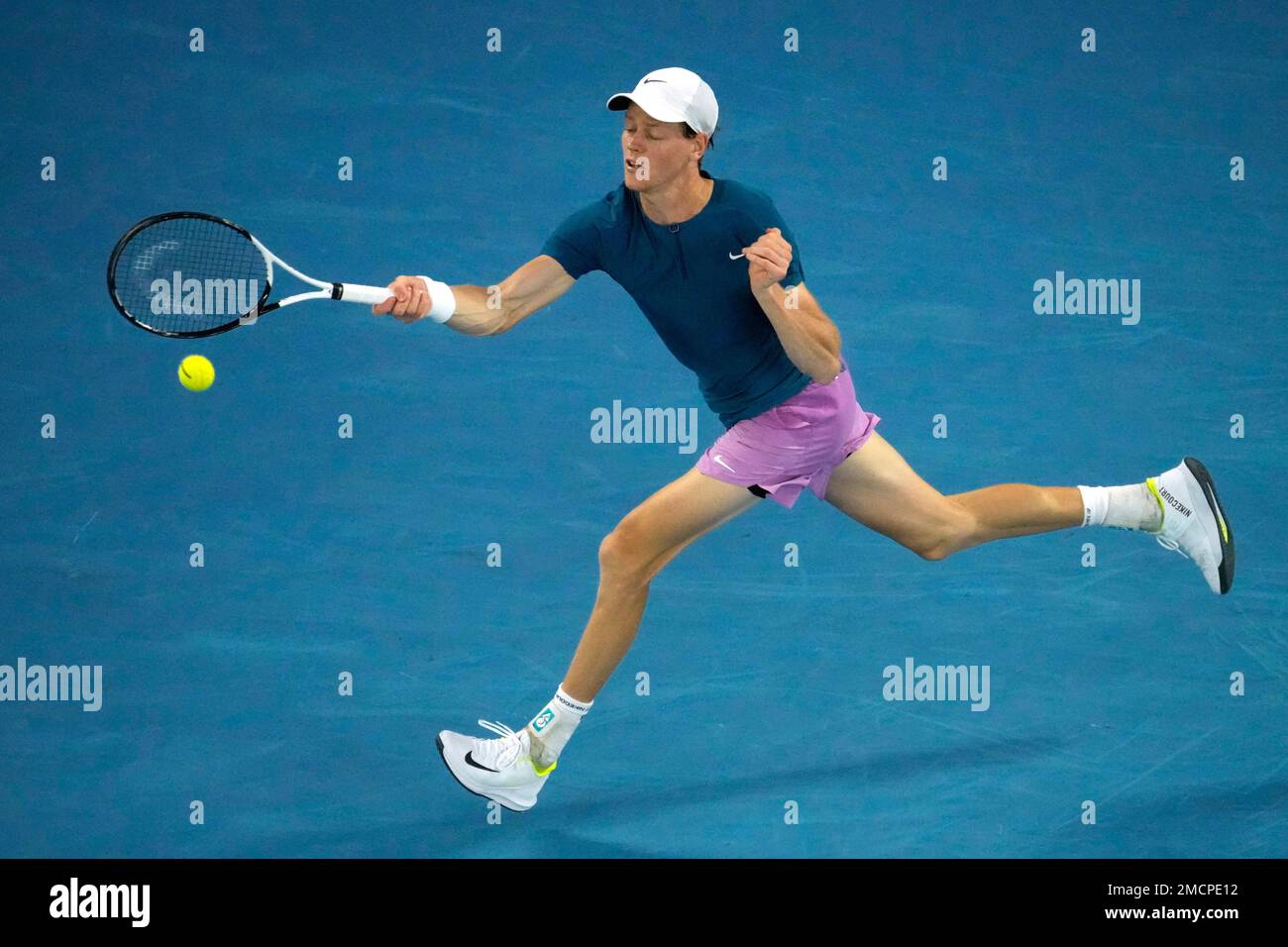 Jannik Sinner of Italy plays a forehand return to Stefanos Tsitsipas of ...