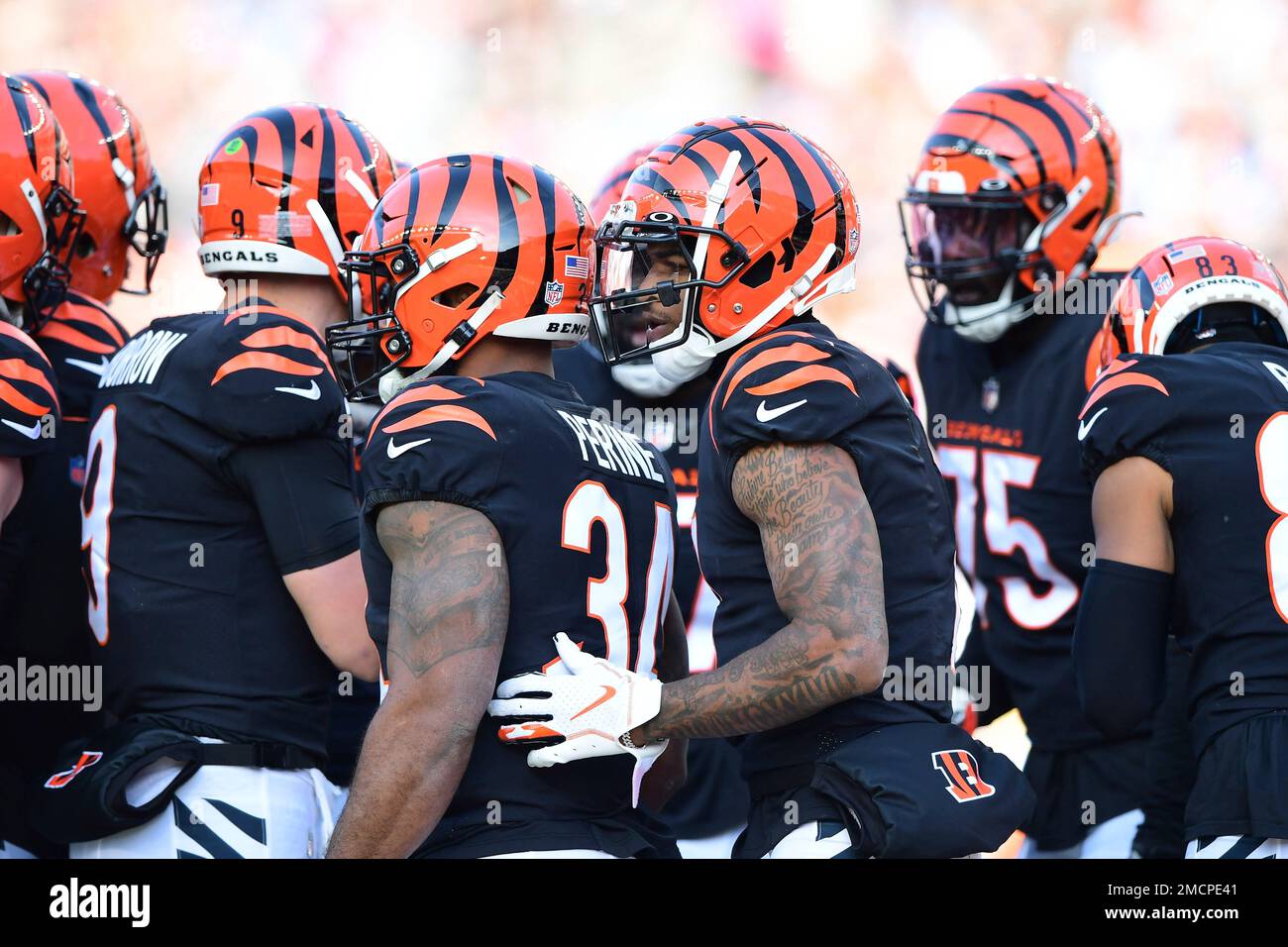 Cincinnati Bengals wide receiver Ja'Marr Chase (1) huddles with ...