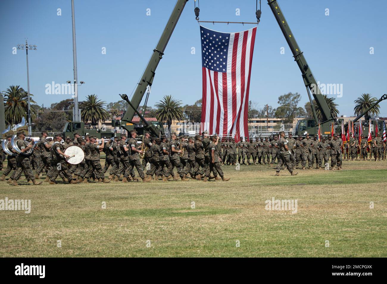 The 1st Marine Division Band walks in front of the formation playing a ...