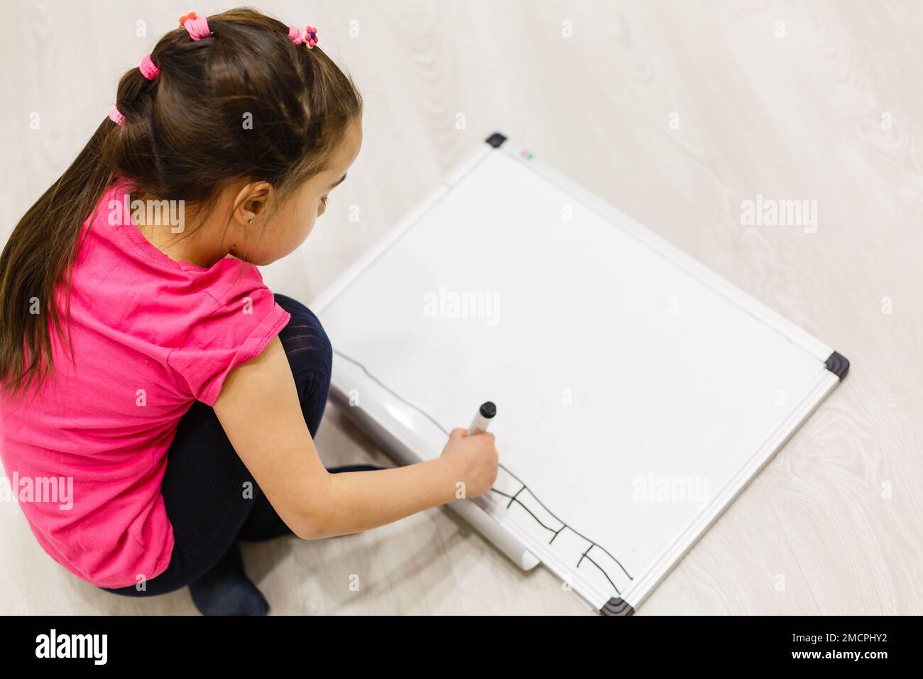 little girl writing on the white board, schooling background Stock ...