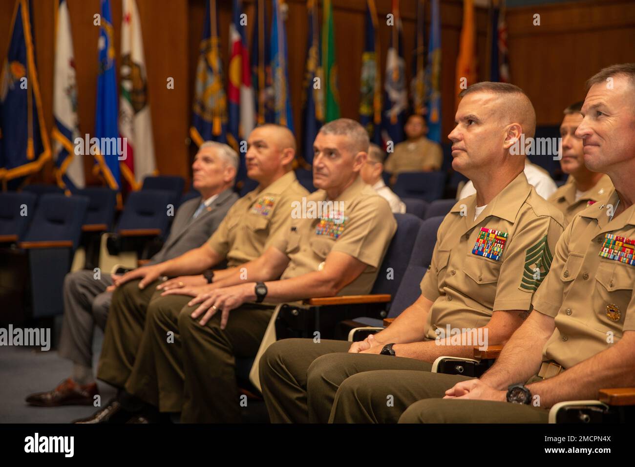 U.S. Marines and civilians look on as Training and Education Command ...