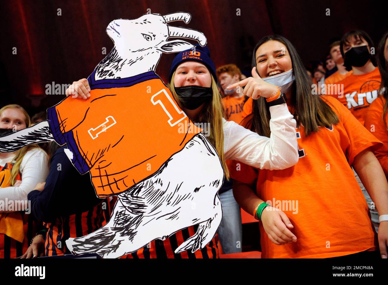 An Illinois fan points to a cardboard goat before an NCAA college ...
