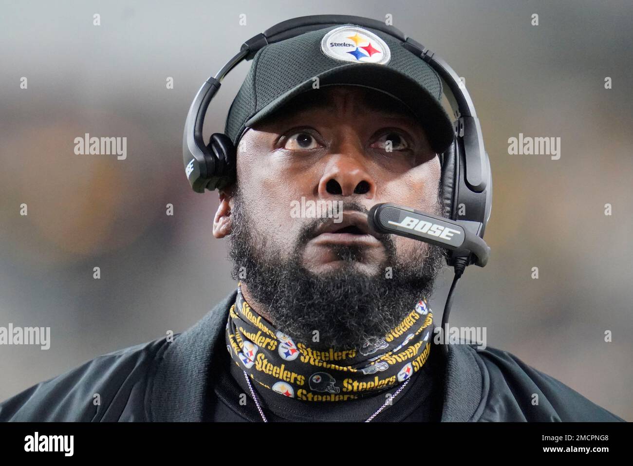 Pittsburgh Steelers head coach Mike Tomlin looks up as he paces the ...