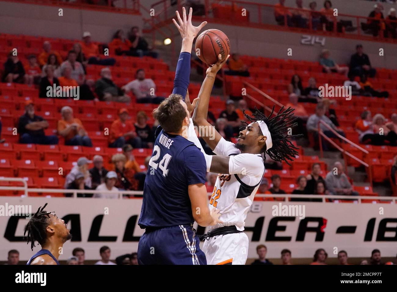 Oklahoma State forward Kalib Boone (22) shoots as Xavier forward Jack ...