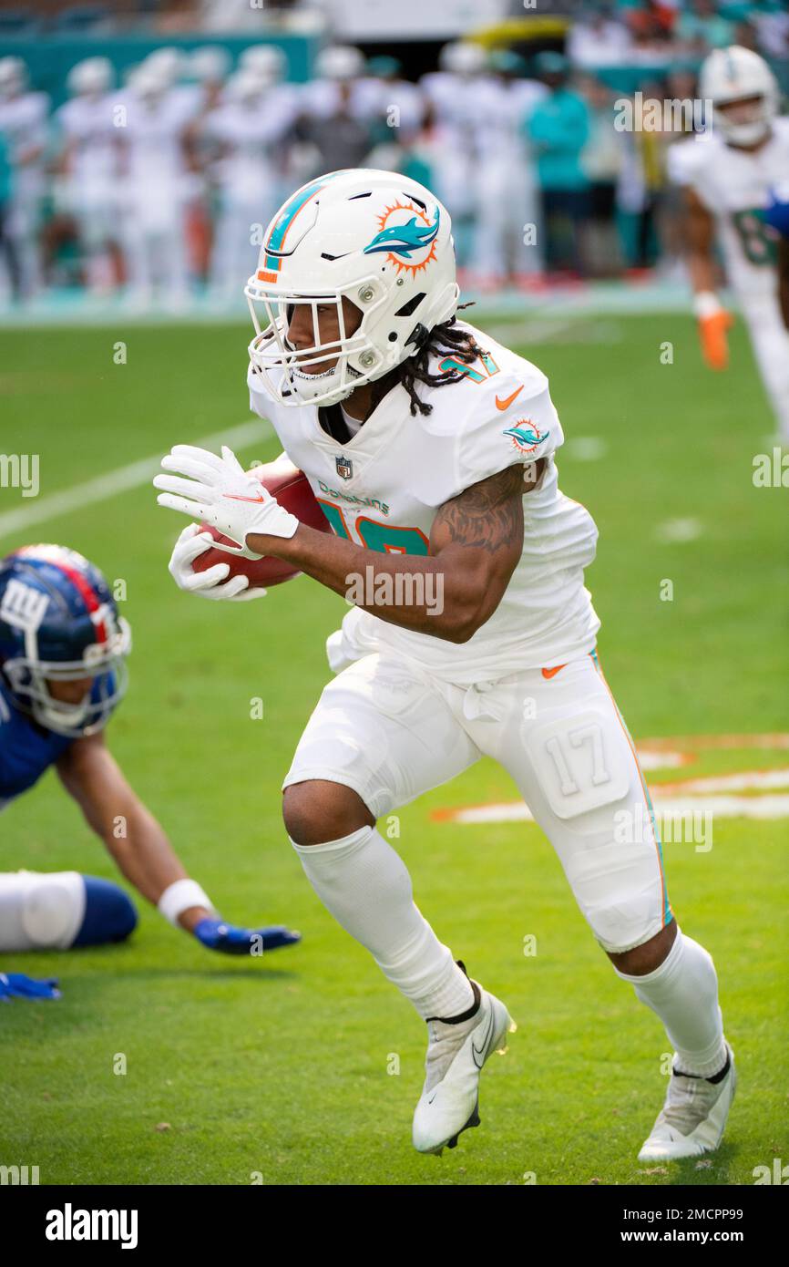 Miami Dolphins wide receiver Jaylen Waddle (17) runs with the ball ...
