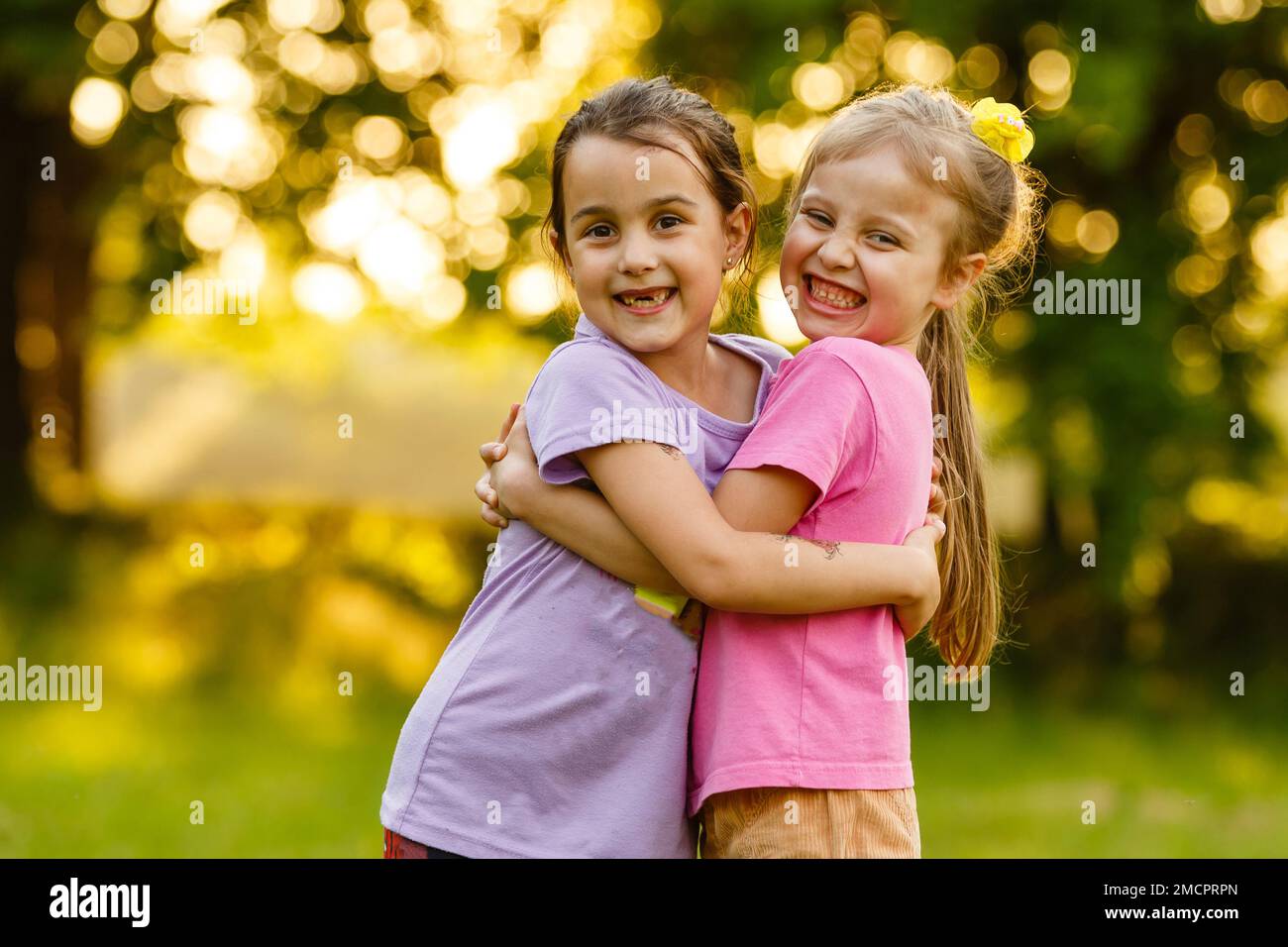 two little friends girls in the field Stock Photo - Alamy