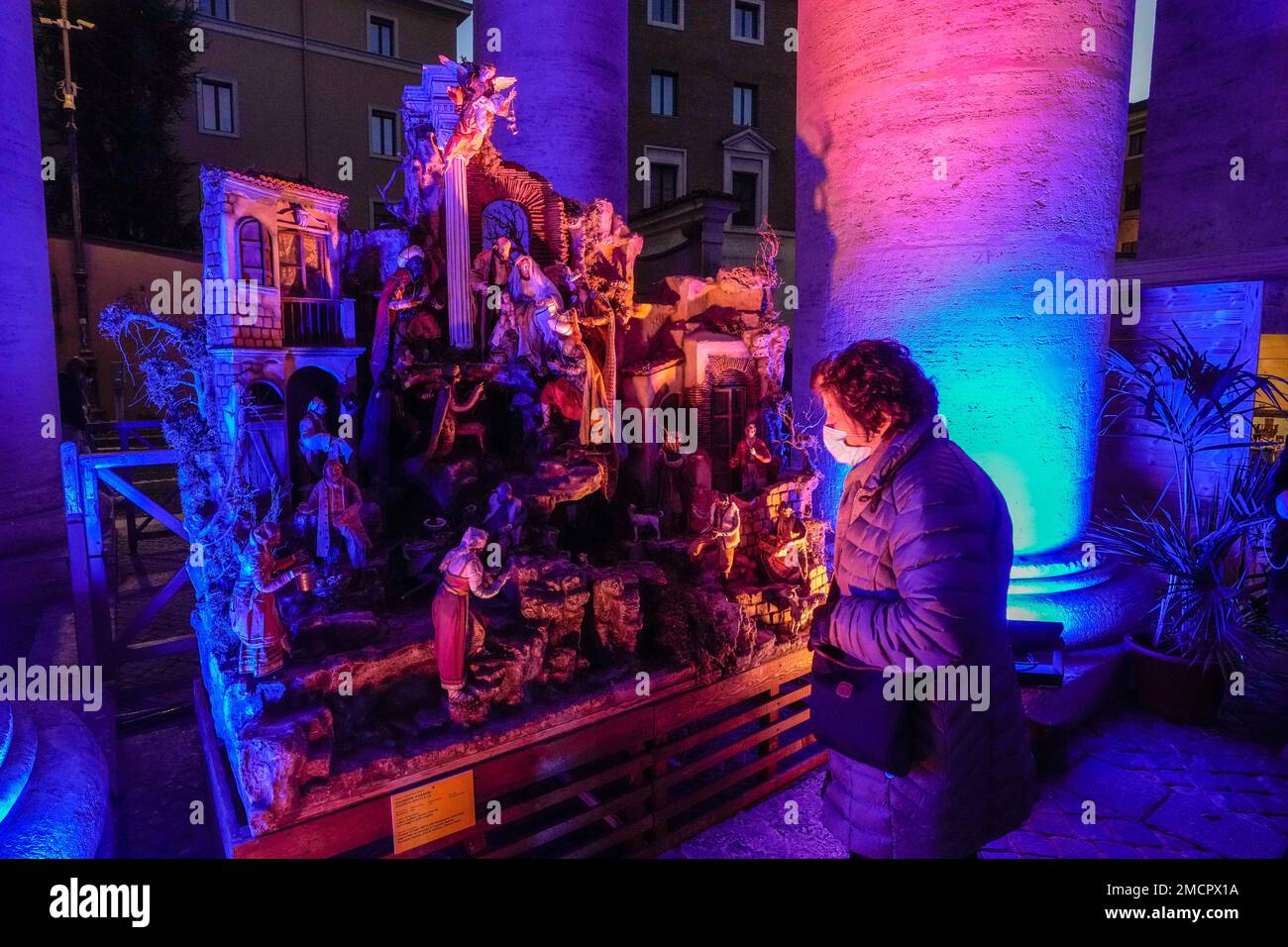 A visitor admires a nativity scene part of the exhibition "100 Presepi ...