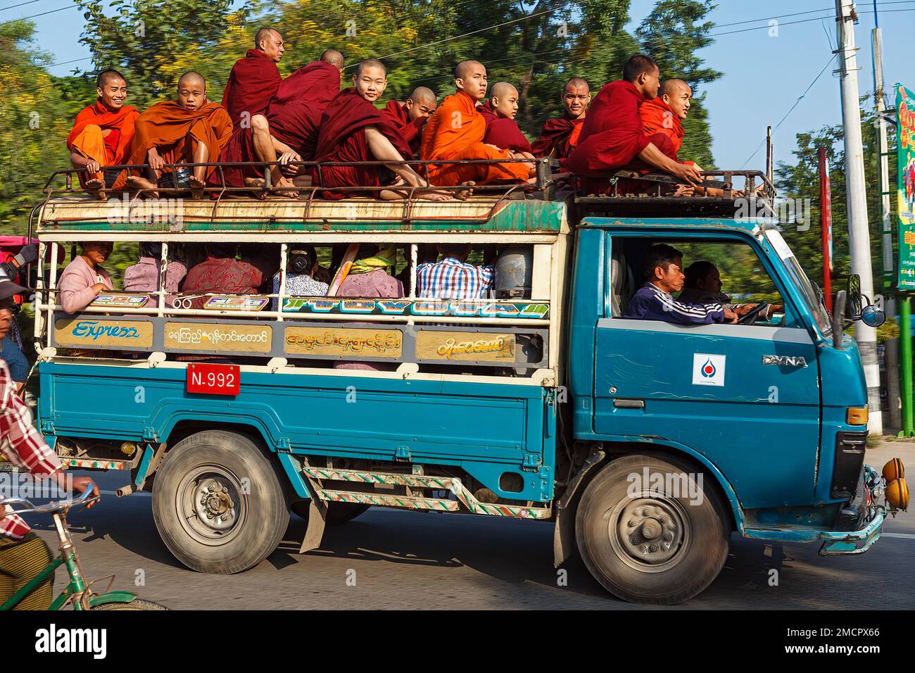 Transport of passengers on a Van in Myanmar Stock Photo - Alamy