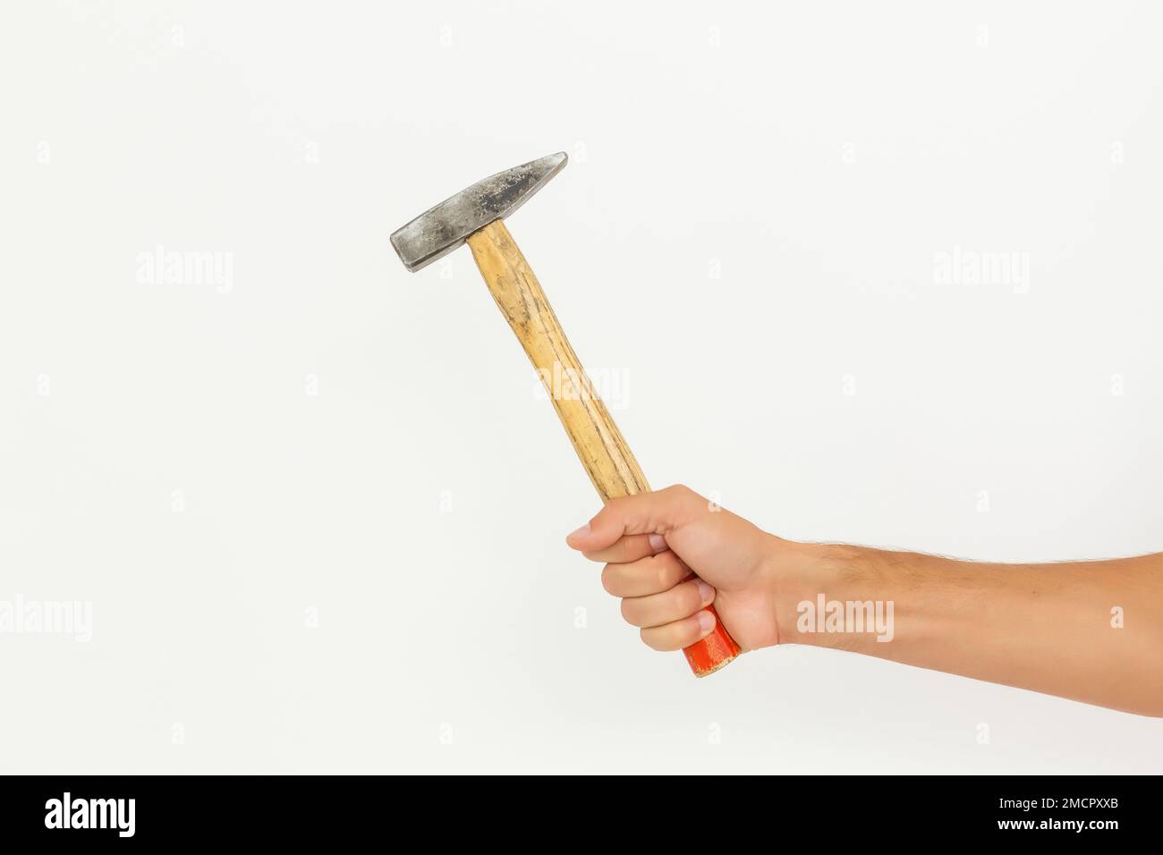Hand with hammer. Isolated on white background Stock Photo - Alamy