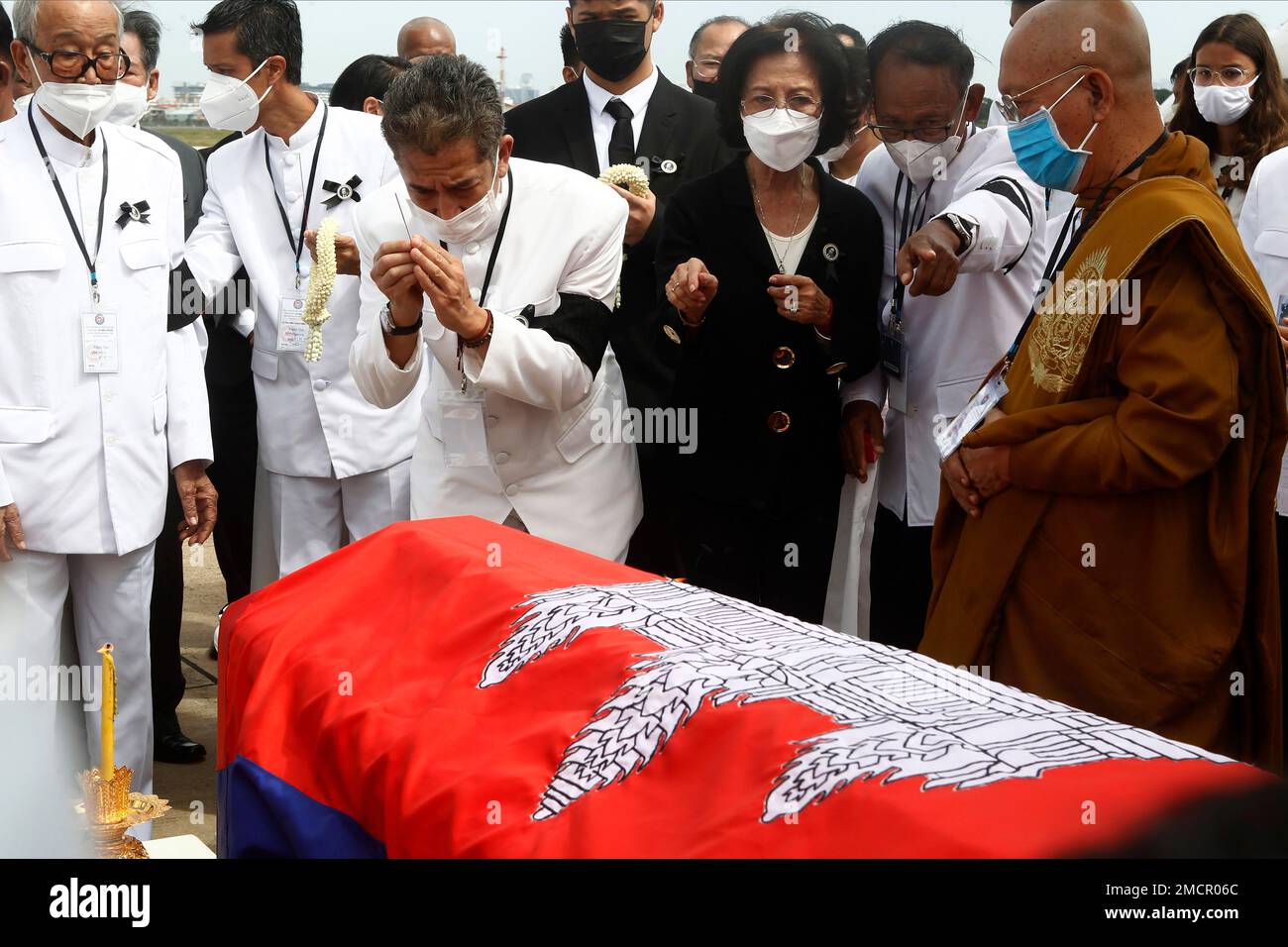 Cambodia's Princess Norodom Marie Ranaiddh, center right, pays respect ...