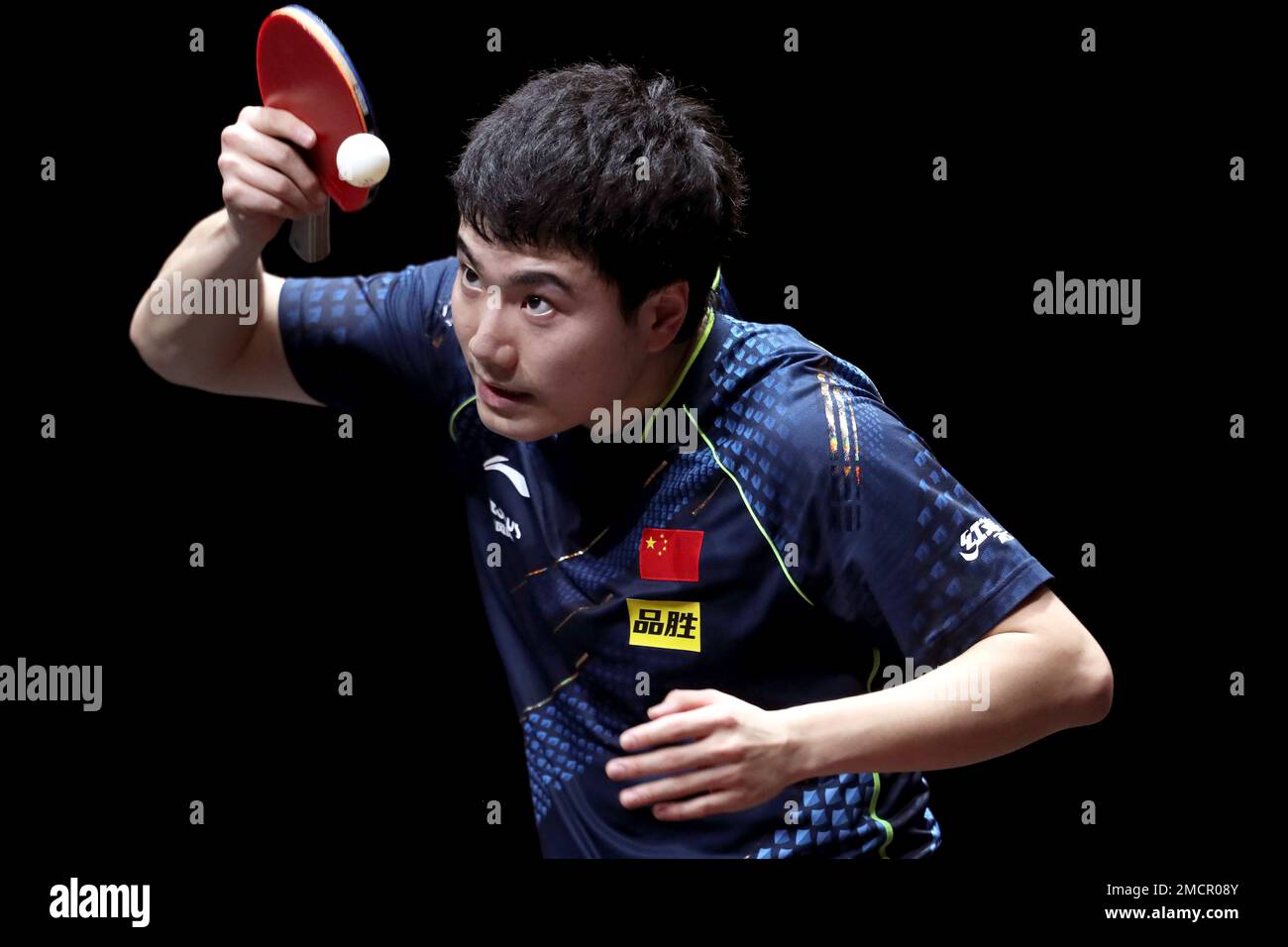 China's Liang Jingkun serves to Nigeria's Quadri Aruna during their ...