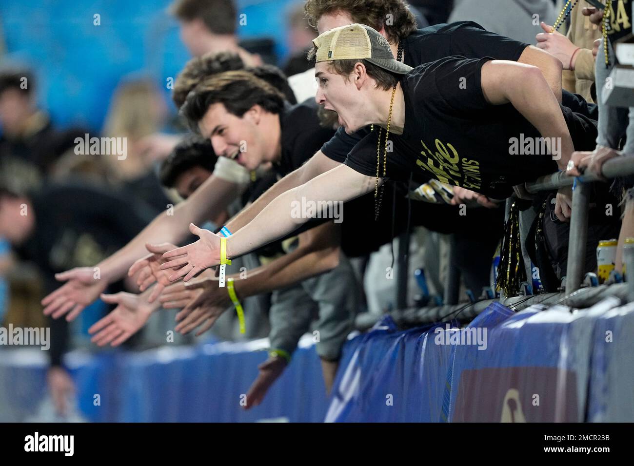 Fans cheer as Wake Forest runs onto the field during warm ups before ...