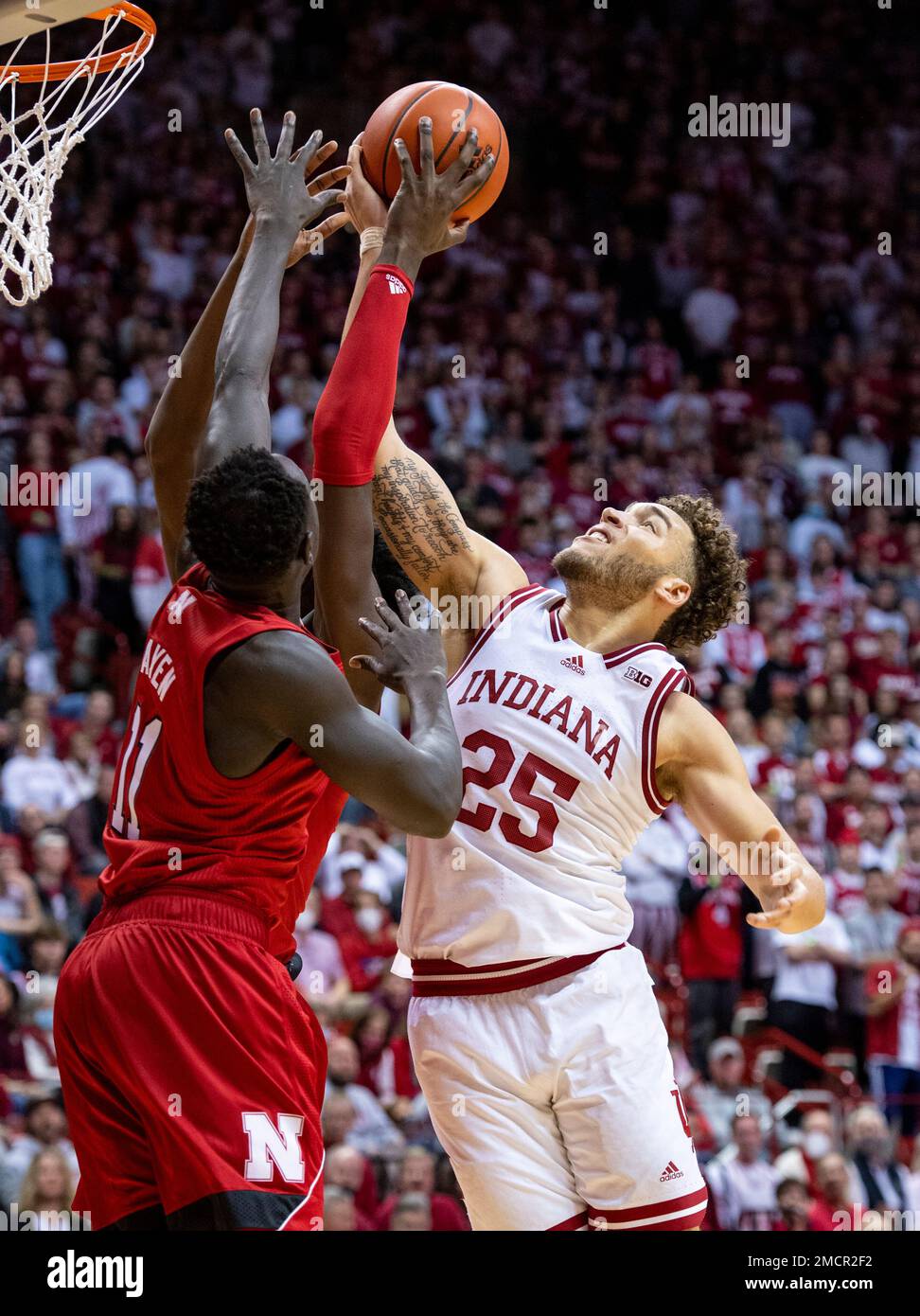 Indiana forward Race Thompson (25) battles for the ball with Nebraska ...