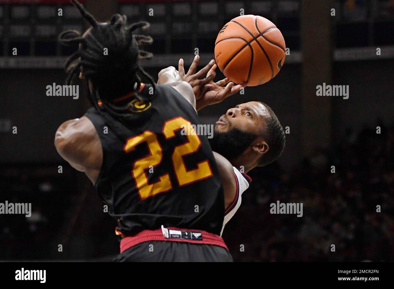 Grambling State's Prince Moss (22) is fouls Connecticut's R.J. Cole in ...