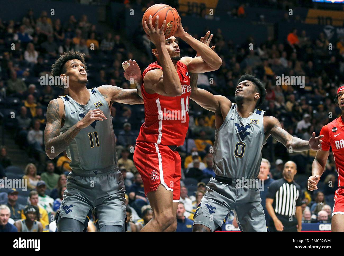Radford forward Chyree Walker (14) shoots as West Virginia forward ...