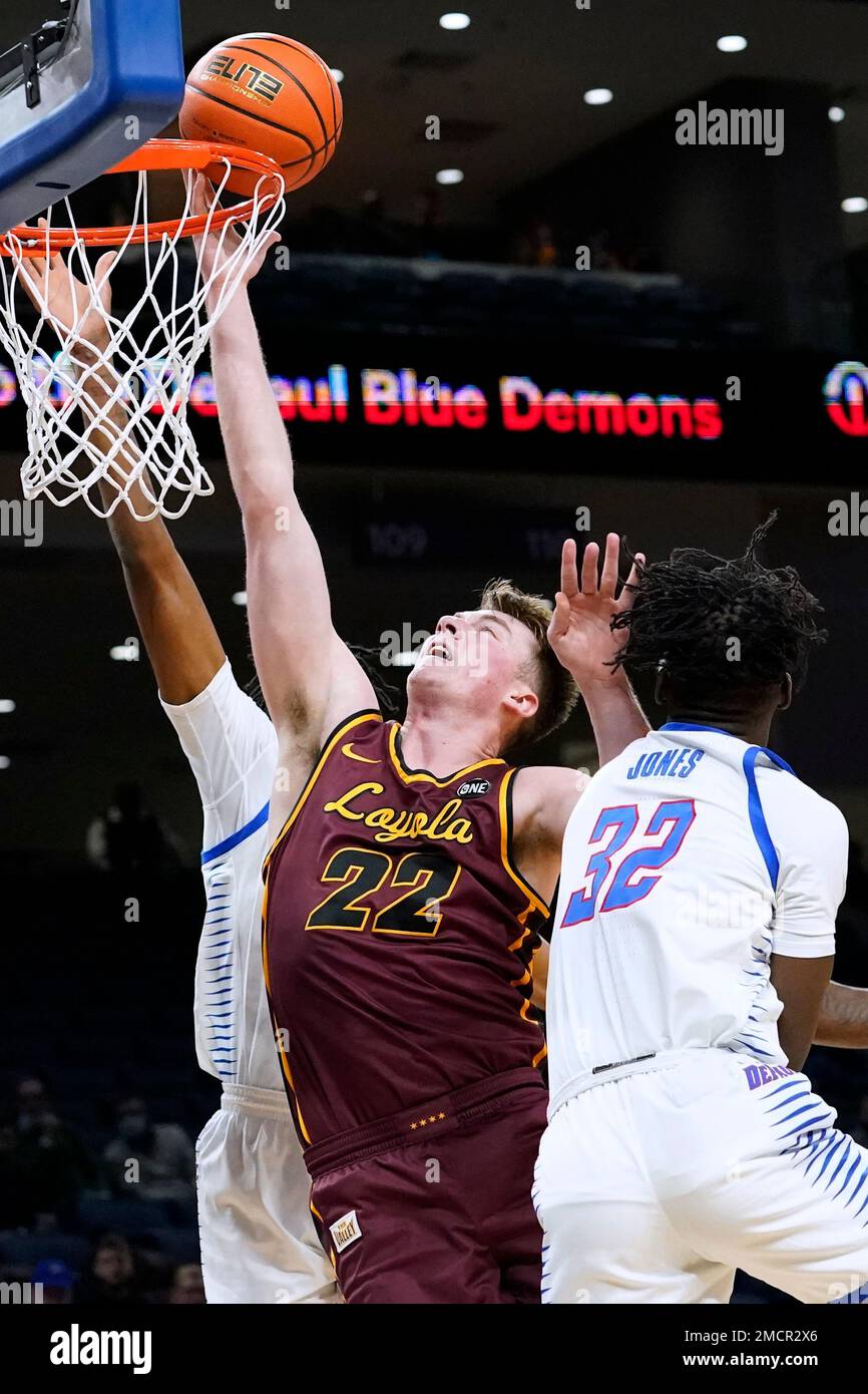 Loyola center Jacob Hutson (22) drives to the basket against DePaul ...