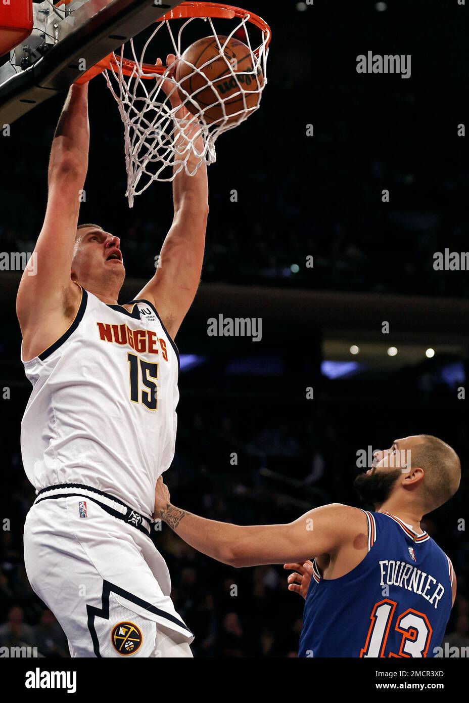 Denver Nuggets center Nikola Jokic (15) dunks the ball over New York ...
