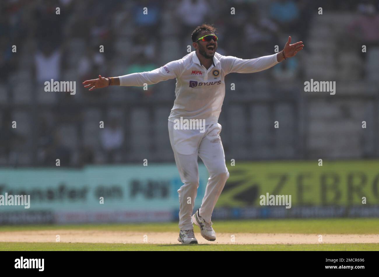 India's Axar Patel celebrates after the dismissal of New Zealand's ...
